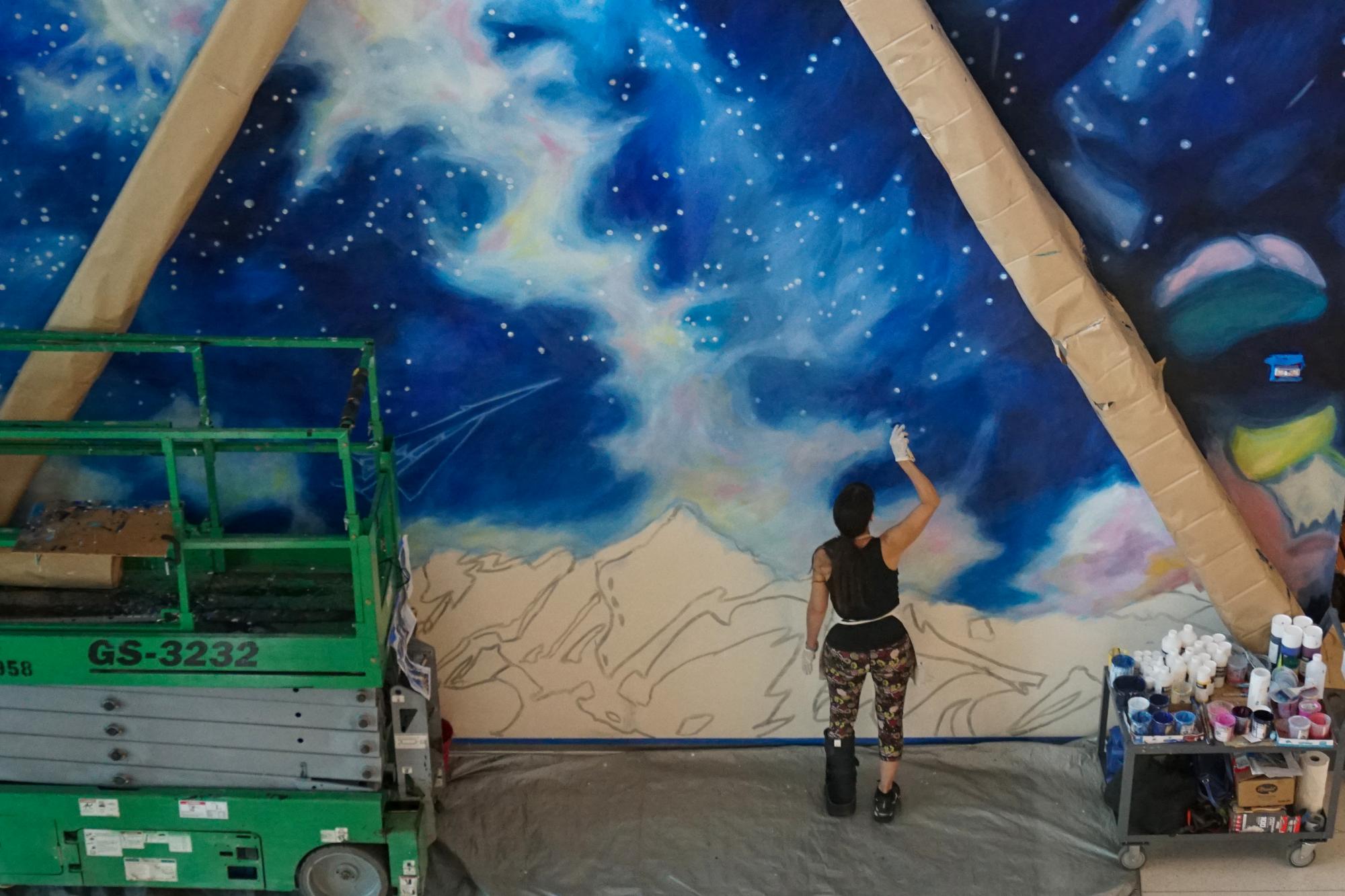 Painting magnificent murals in CU Boulder's new aerospace building ...